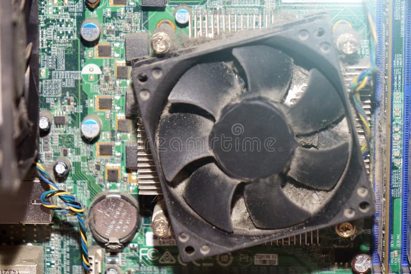 Dust on Computer PC CPU Cooler with Motherboard and a Fragment of the ...