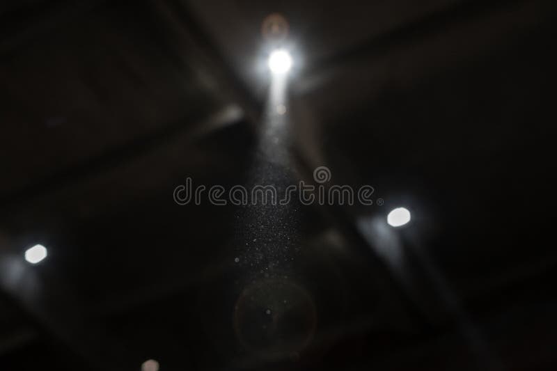 Dust is Illuminated by a Beam of Light through a Hole in the Ceiling in ...