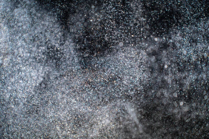 Dust Particles Cloud Generating Abstract Shape on Black Background with ...