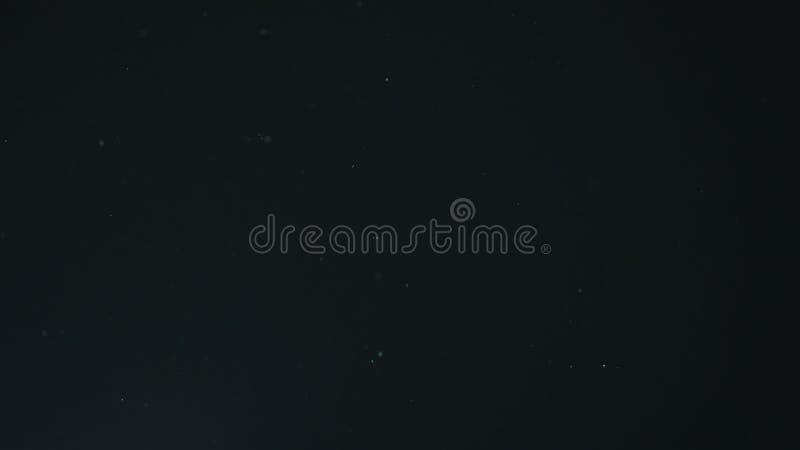 Dust Particles Float in Cool Light on Black Background Stock Image ...