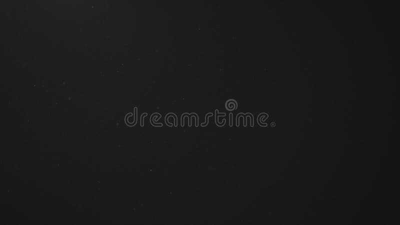 Dust Particles Float in Neutral Light on Black Background Stock Photo ...
