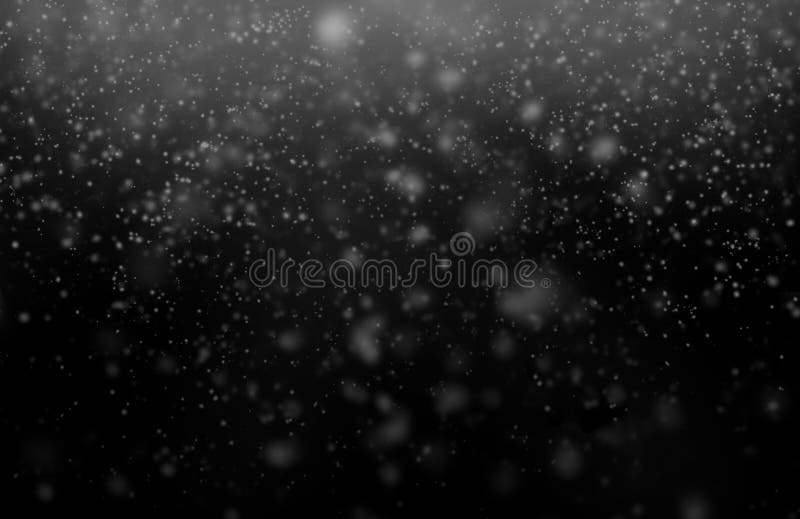 Dust Particles in the Light Rays on a Black Background Stock Photo ...