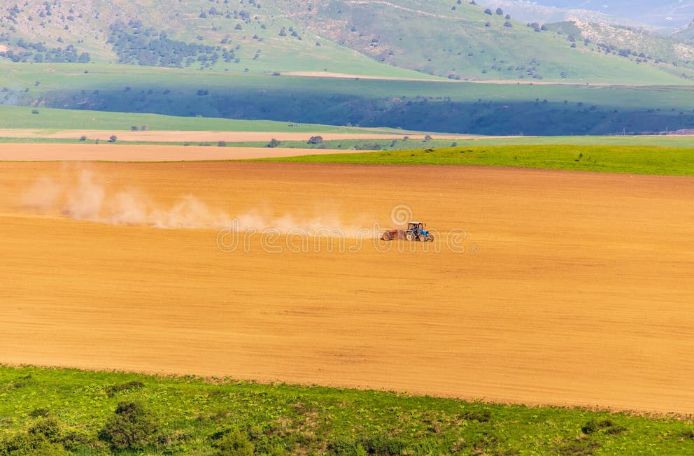 Dust from a Tractor Working in a Field in Spring Stock Photo - Image of ...