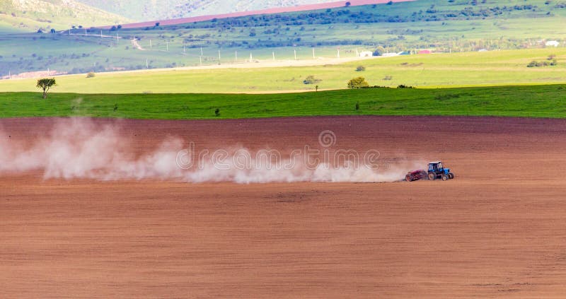 Dust from a Tractor Working in a Field in Spring Stock Photo - Image of ...