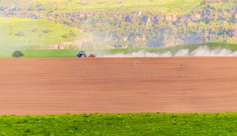 Dust from a Tractor Working in a Field in Spring Stock Photo - Image of ...
