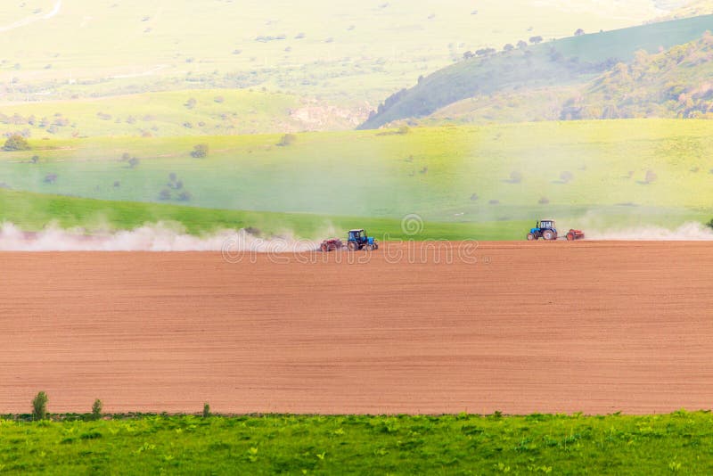 Dust from a Tractor Working in a Field in Spring Stock Photo - Image of ...
