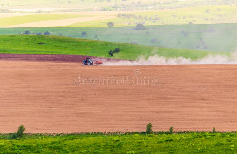 Dust from a Tractor Working in a Field in Spring Stock Photo - Image of ...