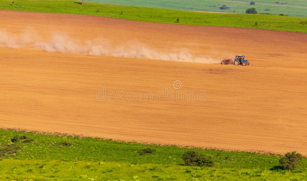 Dust from a Tractor Working in a Field in Spring Stock Image - Image of ...