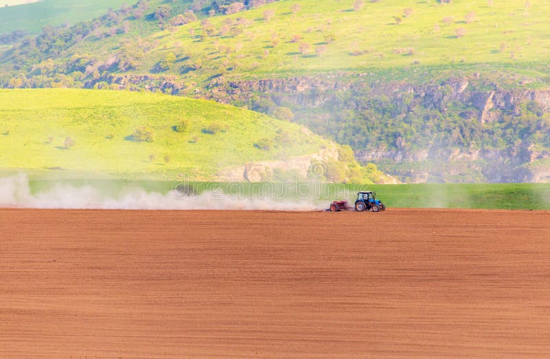 Dust from a Tractor Working in a Field in Spring Stock Photo - Image of ...