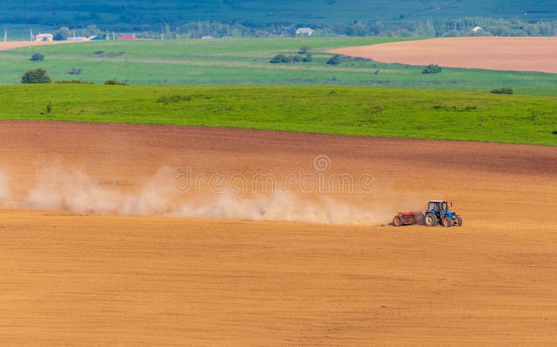 Dust from a Tractor Working in a Field in Spring Stock Photo - Image of ...