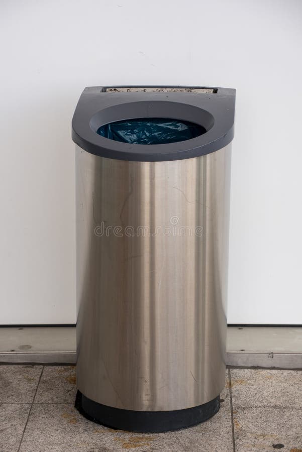 Dustbin with Ashtray in Front of a White Wall Stock Photo - Image of ...