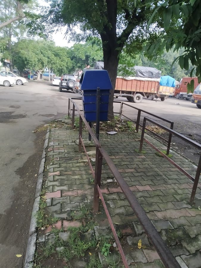 Dustbin Blue for Garbage on Roadside Stock Photo - Image of blue ...