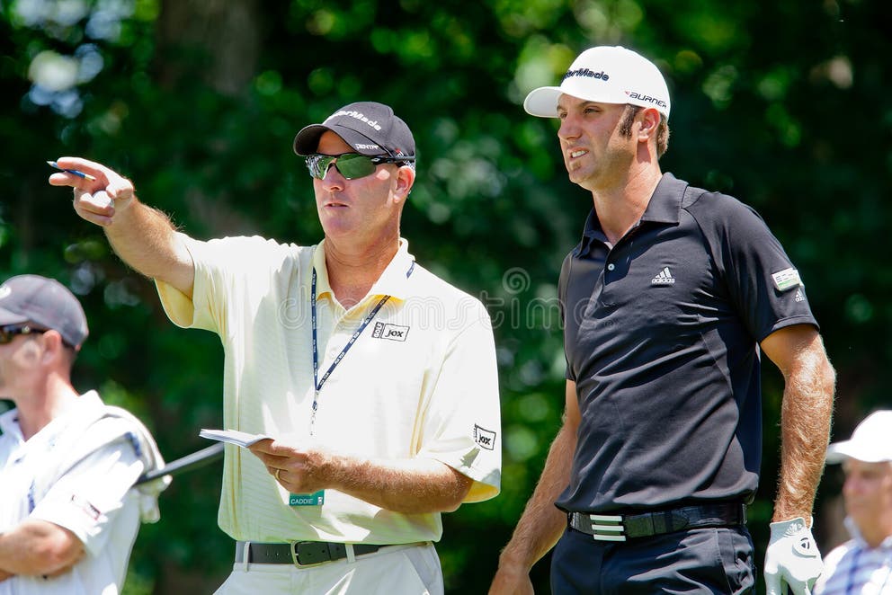 Dustin Johnson and Caddy Joe LaCava Editorial Photography - Image of ...