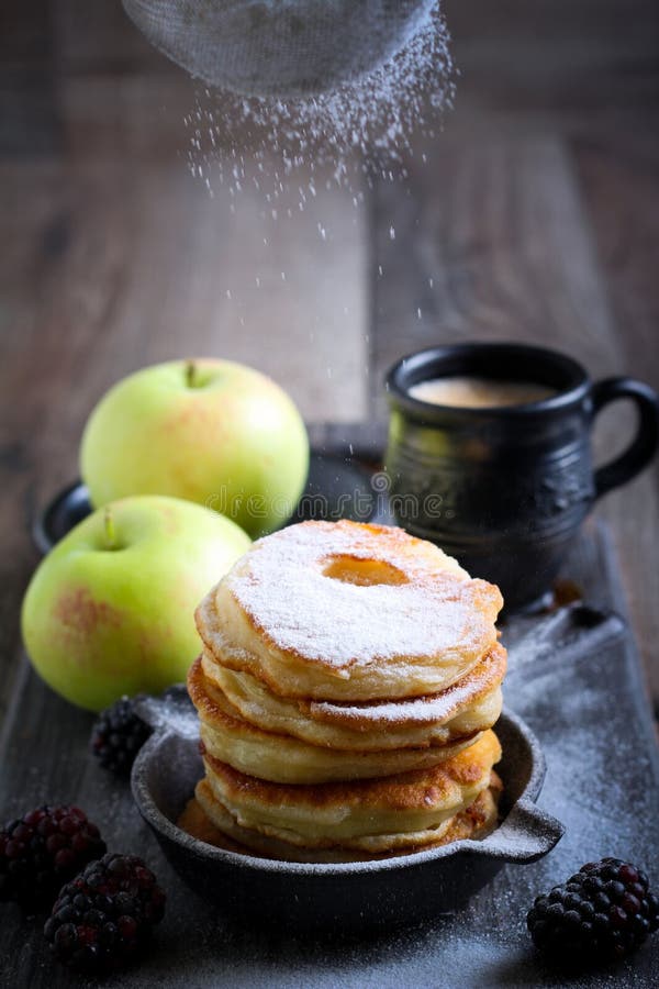 Dusting with Icing Sugar Over Apple Fritters Stock Photo - Image of ...