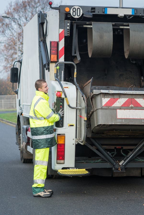 Dustman next to lorry bin stock photo. Image of vehicle - 260782134