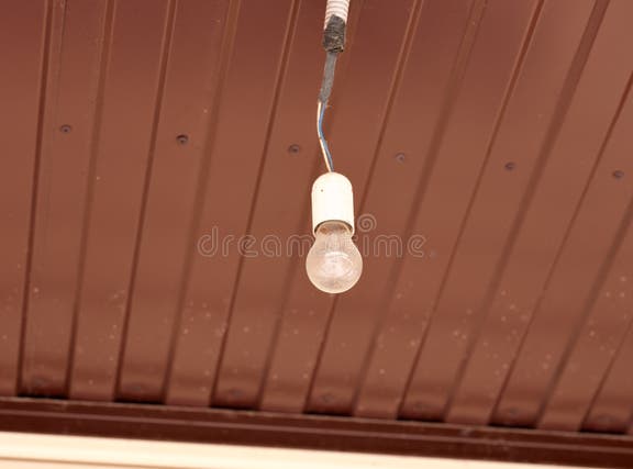 Dusty Light Bulb Hanging from a Ceiling Stock Photo - Image of ...