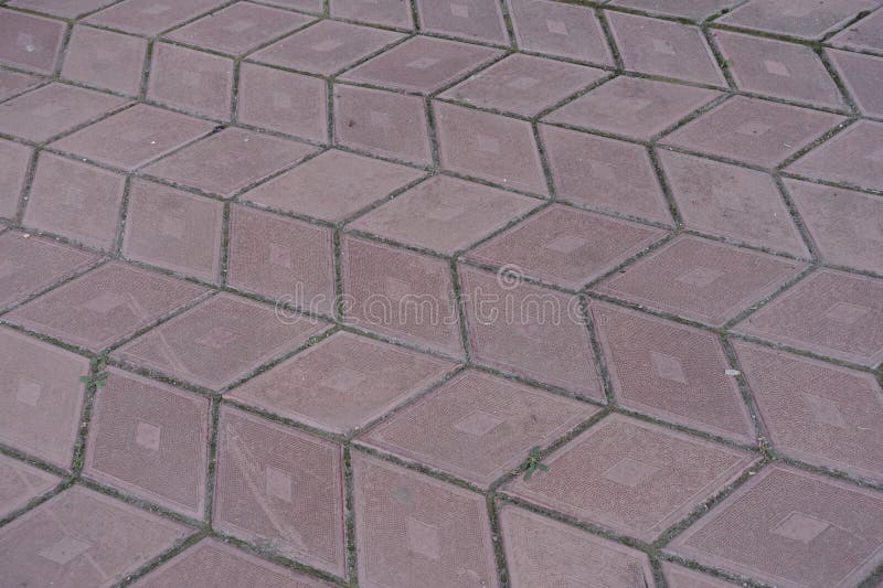 Dusty Surface of Grayish Pink Diamond-shaped Concrete Pavement with ...