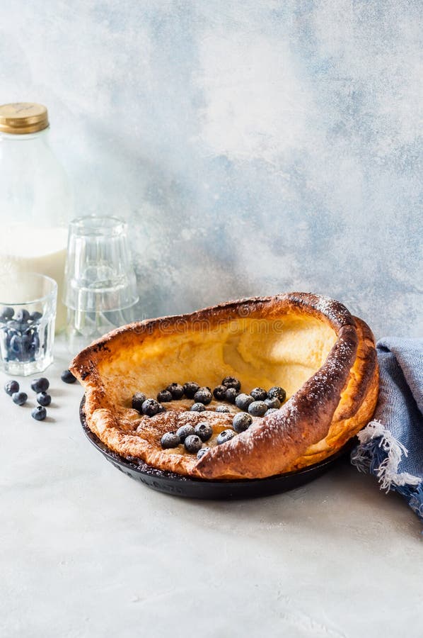 Dutch Baby with Blueberries Stock Image - Image of dutch, browned ...