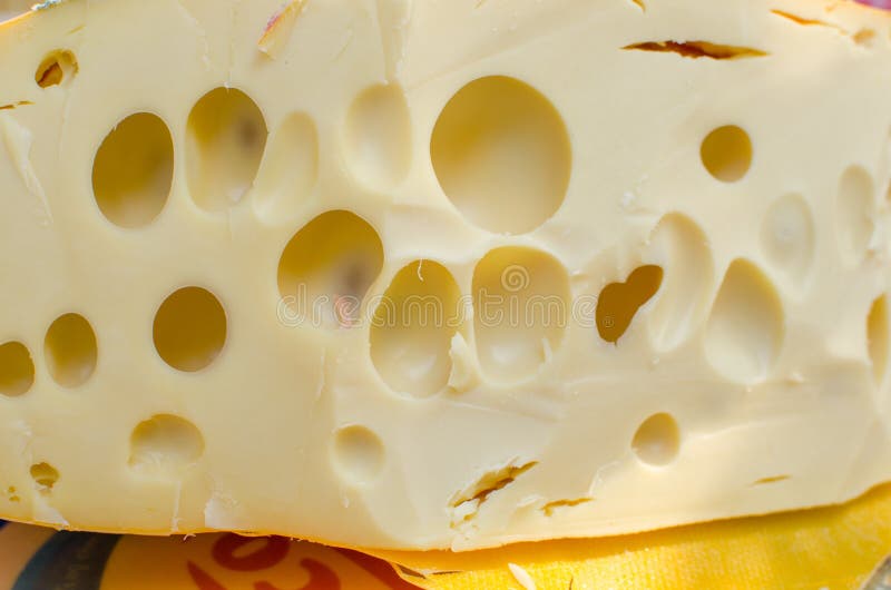 Dutch cheese with holes stock image. Image of gourmet - 124621275