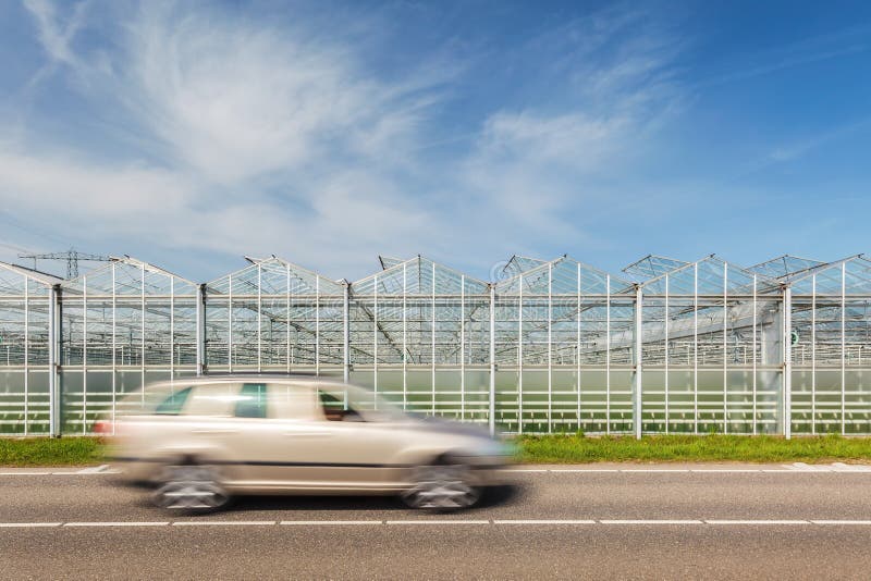 Dutch Greenhouse with Passing Car Stock Photo - Image of transportation ...