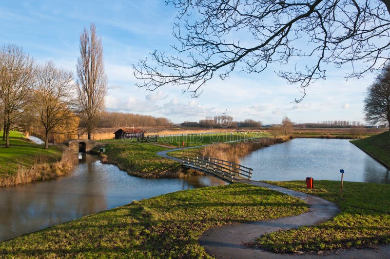 Sunset windmill landscape stock image. Image of river - 10070093