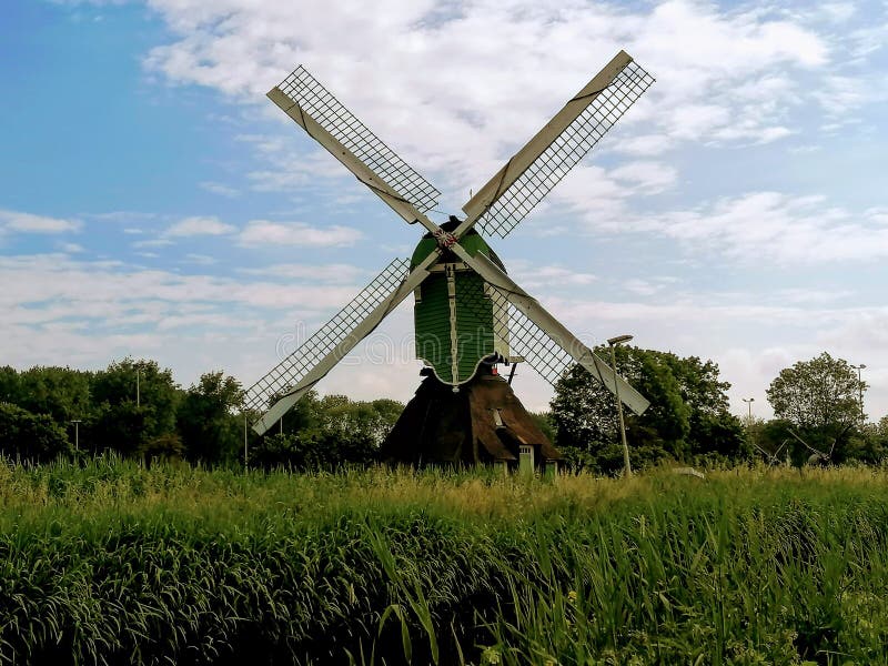Dutch mill stock image. Image of grassland, tower, windmill - 245451551