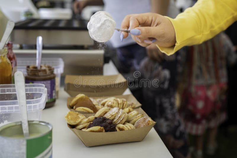 Fluffy Mini Pancakes that are Served with a Mess of Powdered Sugar and ...