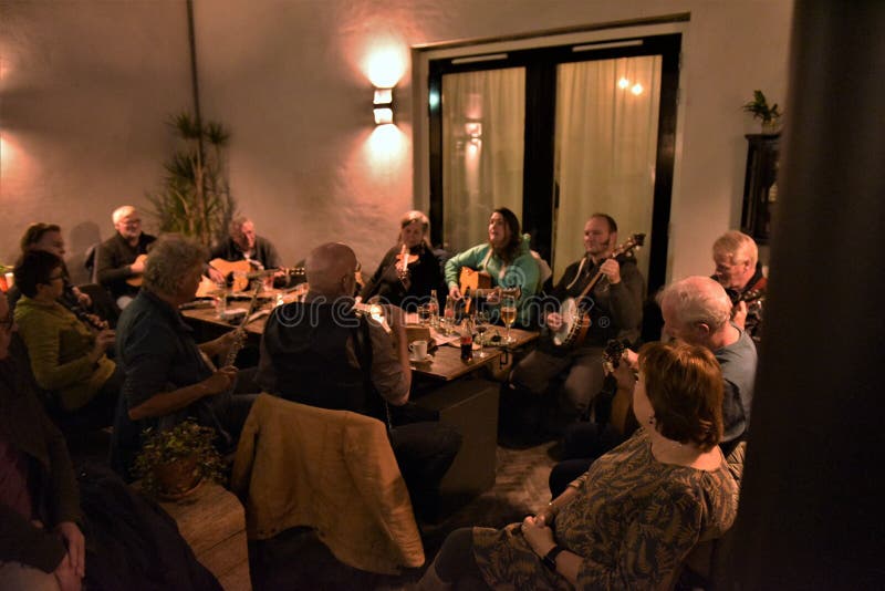 Dutch People Sitting at the Table and Playing Musical Instruments in ...