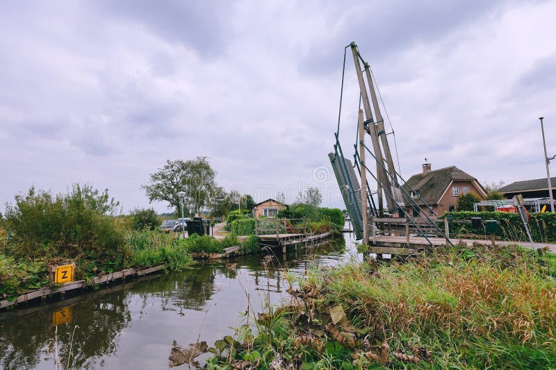 Dutch Rural Scenery, Road and Bridge Over the Canal Stock Photo - Image ...