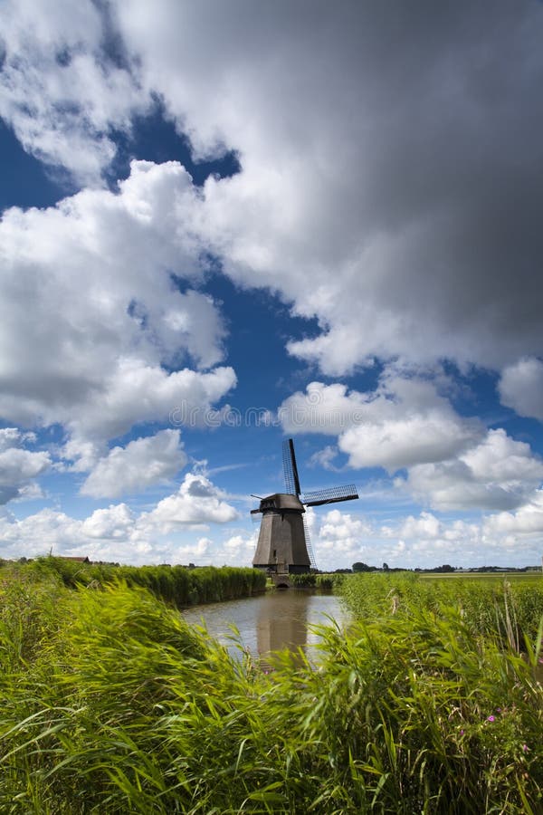 Dutch windmill stock image. Image of blue, idyllic, holland - 15436905