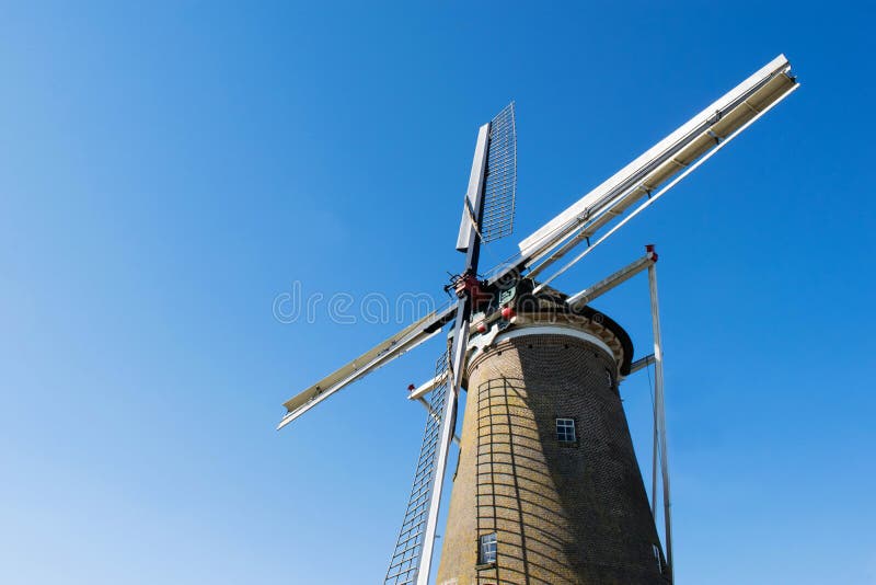 Dutch Windmill with Bright Blue Sky Background Stock Image - Image of ...
