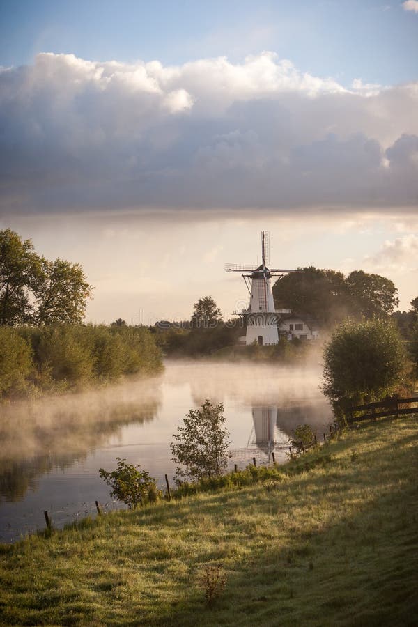 Dutch Windmill and Dramatic Sky Stock Image - Image of drama, evening ...