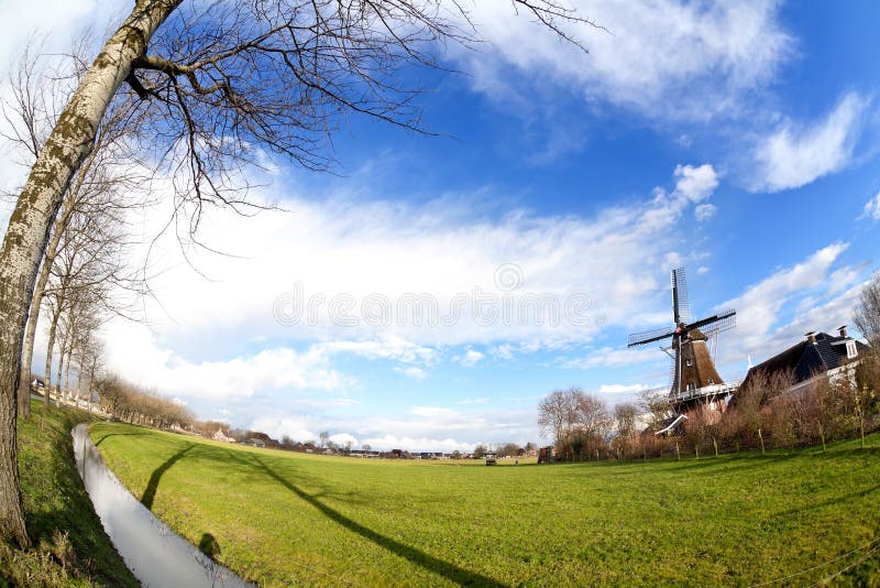 Windmill on Pasture at Sunrise Stock Photo - Image of sunlight ...