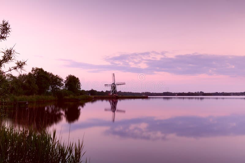 Dutch windmill at sunset stock photo. Image of culture - 29893294