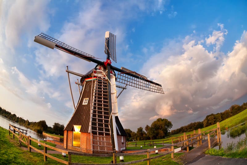 Dutch Windmill Over Blue Sky Stock Photo - Image of blue, outside: 33474938