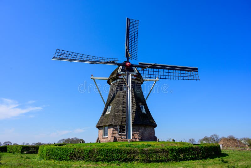 Dutch Windmill in Spring Time with Blue Sky Stock Image - Image of ...