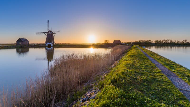 Dutch WindmIll during Sunset Stock Photo - Image of sunset, holland ...