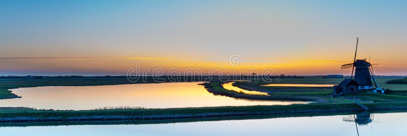 Dutch WindmIll during Sunset Stock Photo - Image of field, colorful ...