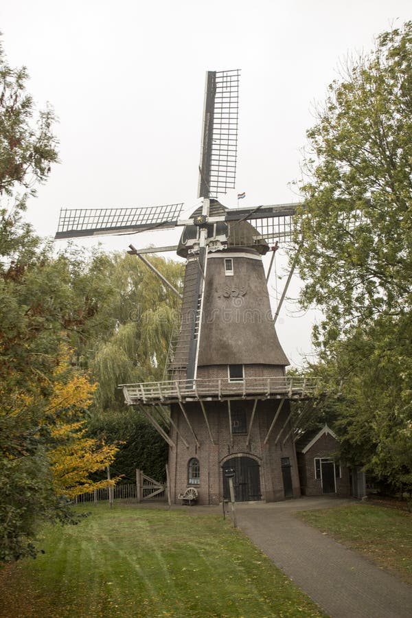 Dutch Windmill in between Trees Stock Photo - Image of windmill, retro ...