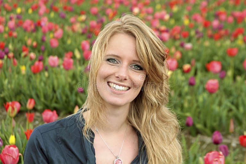 Dutch Woman In The Tulip Fields Stock Images - Image: 24374834