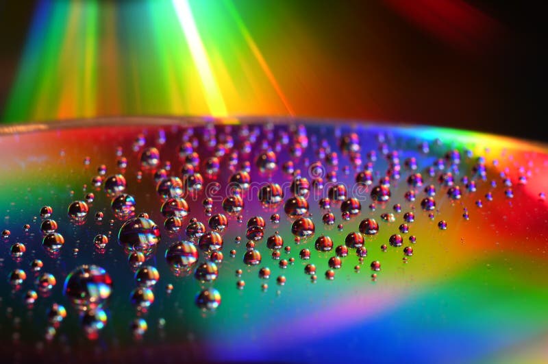 DVD and CD Disc with Water Drops Colour Background. Stock Photo - Image ...