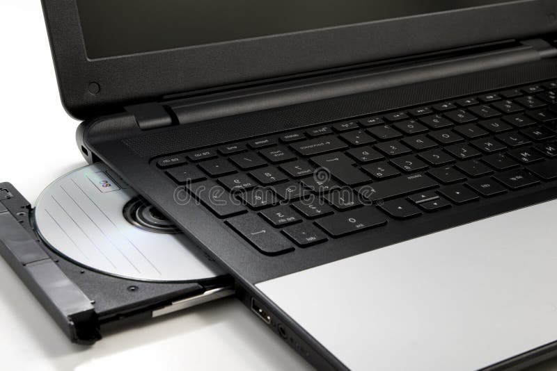 Dvd cd rom and laptop stock image. Image of business - 82916319