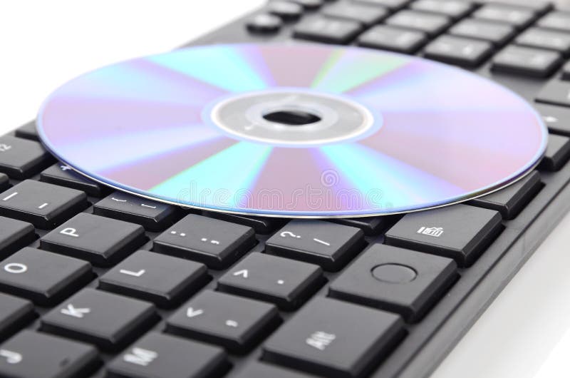 DVD and computer keyboard stock image. Image of digitalized - 26697953