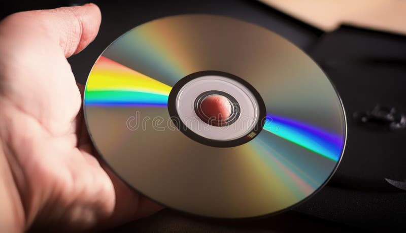 DVD disc in hand stock photo. Image of game, film, cdrom - 78713218