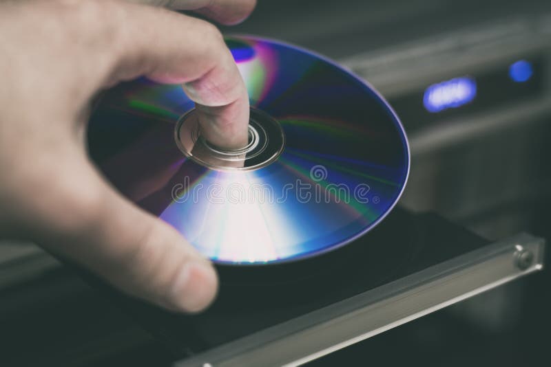 DVD disc in hand stock photo. Image of data, cover, cdrom - 78765886