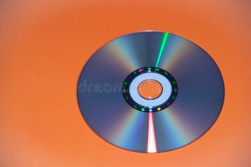 Dvd Disk on an Orange Background. CD Stock Photo - Image of green ...