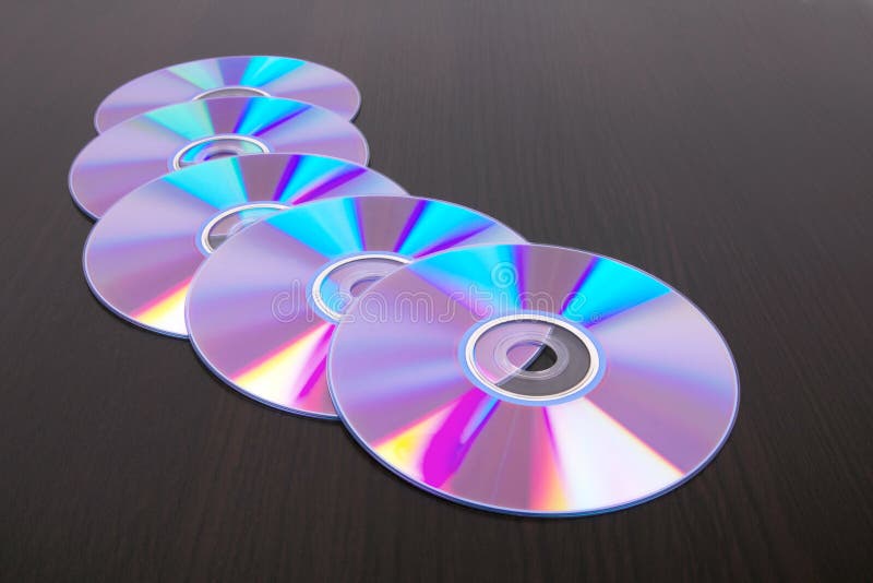 Dvd Disks on Black Wooden Table Stock Image - Image of device, black ...