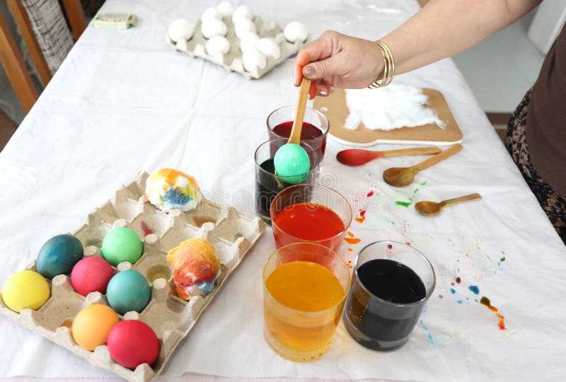 Dye or Dyeing Easter Eggs. Coloring and Painting Easter Eggs Stock ...