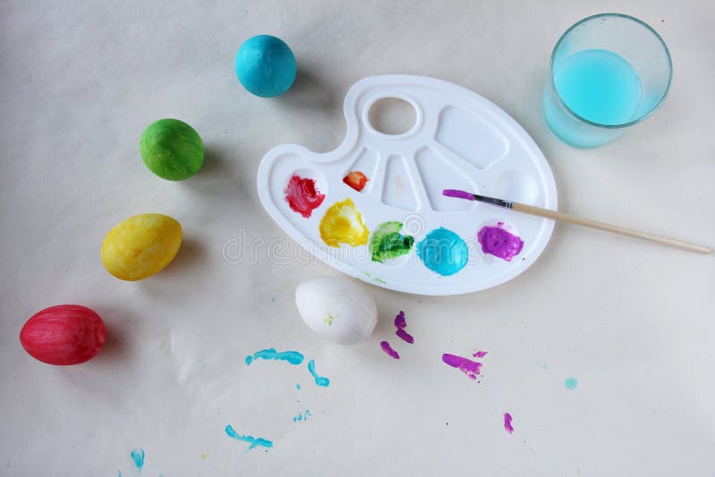 Dyeing Easter Eggs. Paints, Palette, Brush and Eggs on Table, View from ...