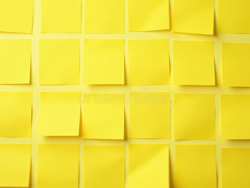 A Dynamic Arrangement of Bright Yellow, Torn Sticky Notes on a Light ...
